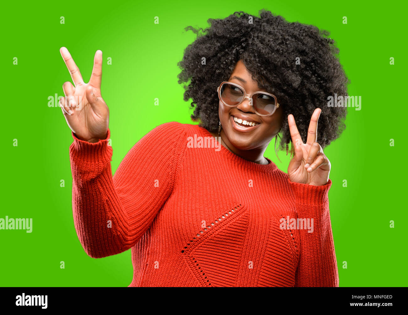Beautiful african woman happy and excited expressing winning gesture ...