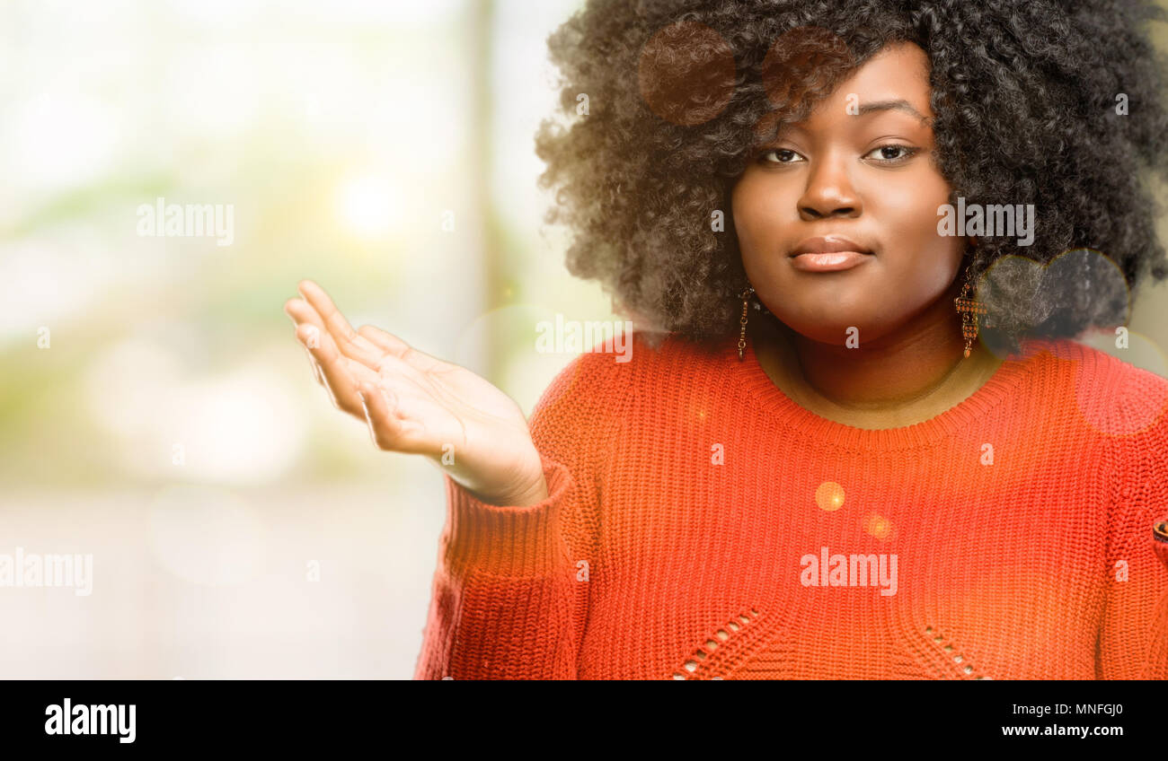 Beautiful african woman doubt expression, confuse and wonder concept ...