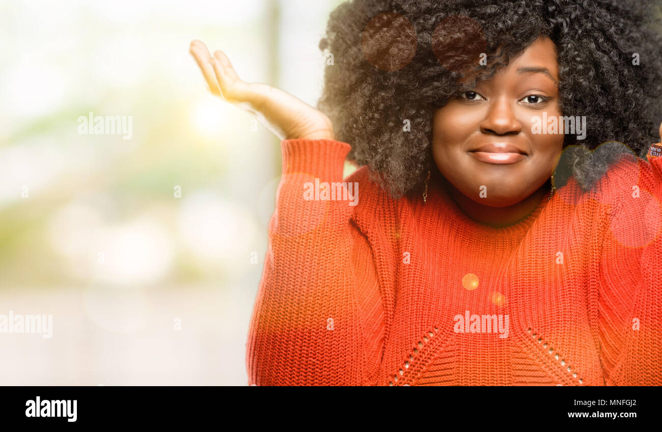 Beautiful african woman doubt expression, confuse and wonder concept ...