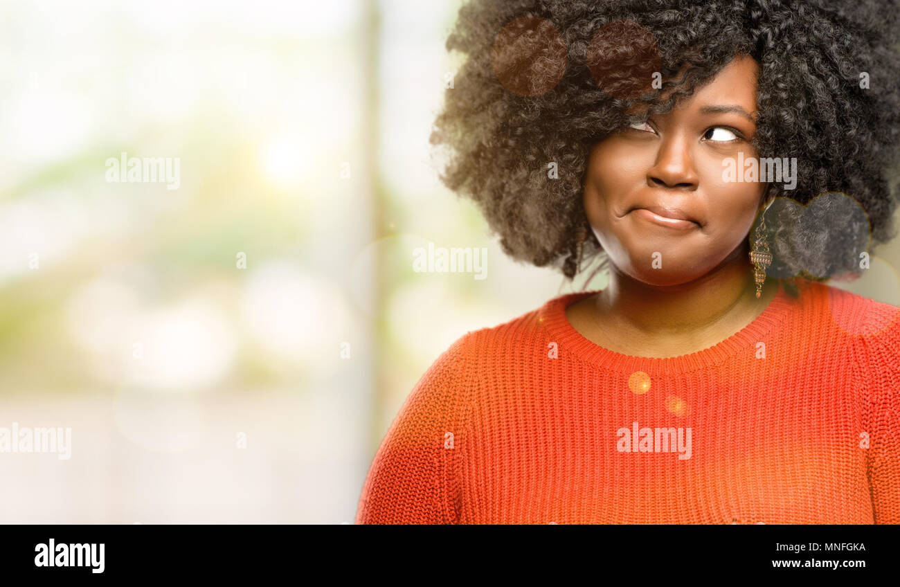 Beautiful african woman doubt expression, confuse and wonder concept ...