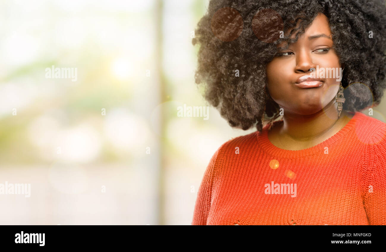 Beautiful african woman doubt expression, confuse and wonder concept ...