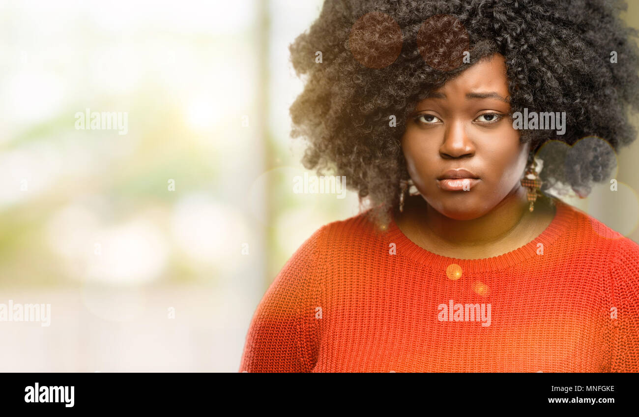 Beautiful african woman with sad and upset expression, unhappy, outdoor ...