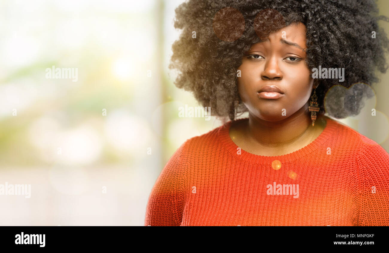 Beautiful african woman with sad and upset expression, unhappy, outdoor ...