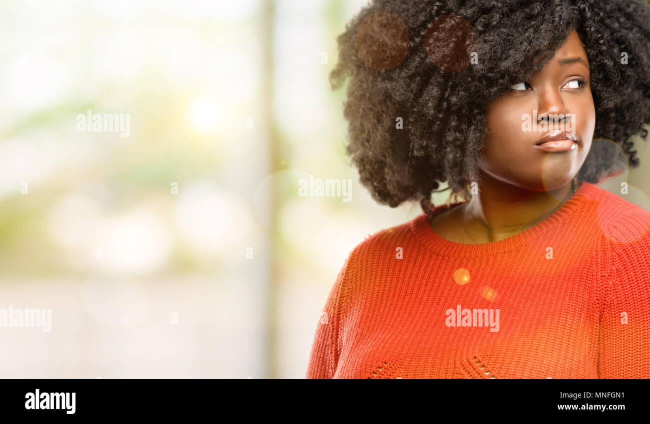Beautiful african woman doubt expression, confuse and wonder concept ...