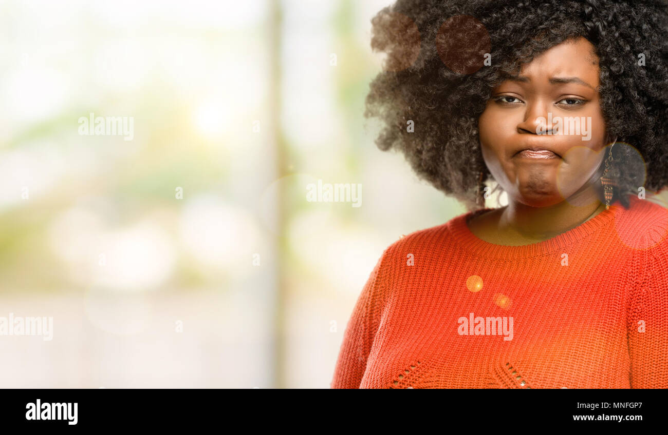 Beautiful african woman doubt expression, confuse and wonder concept ...