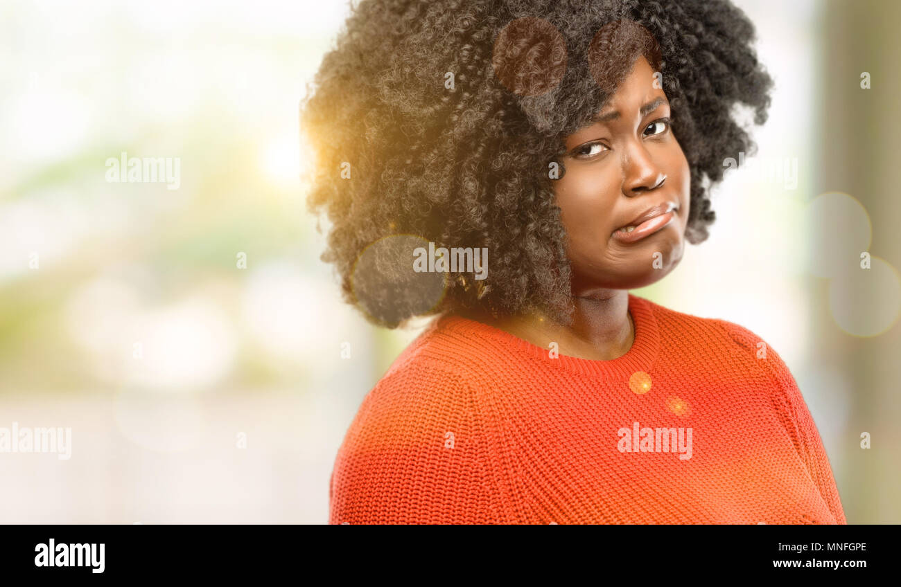 Beautiful african woman doubt expression, confuse and wonder concept ...