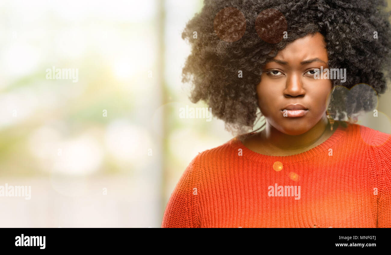 Beautiful african woman irritated and angry expressing negative emotion ...