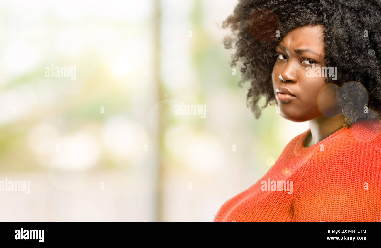 Beautiful african woman irritated and angry expressing negative emotion ...