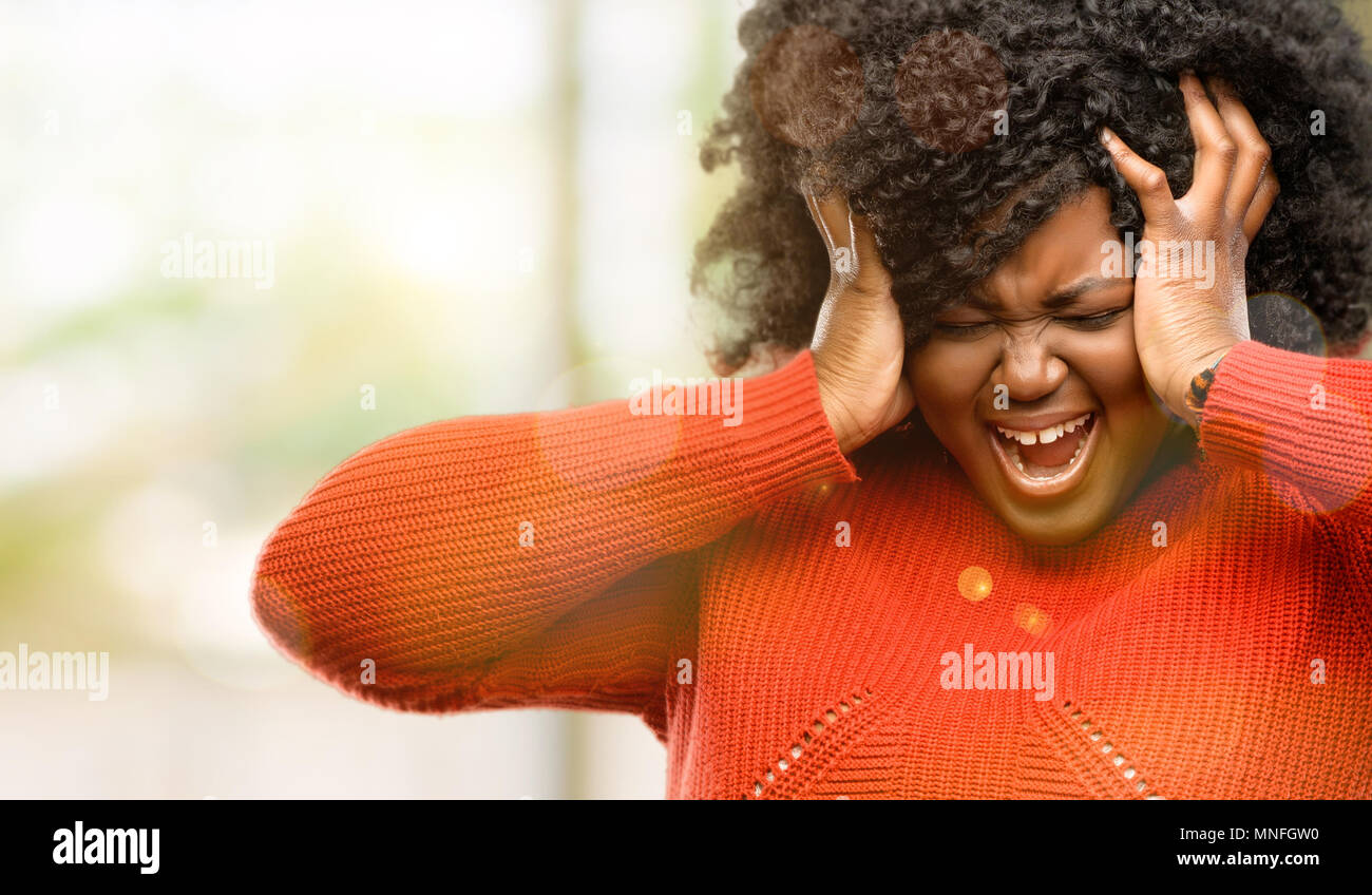 Beautiful african woman stressful keeping hands on head, terrified in ...