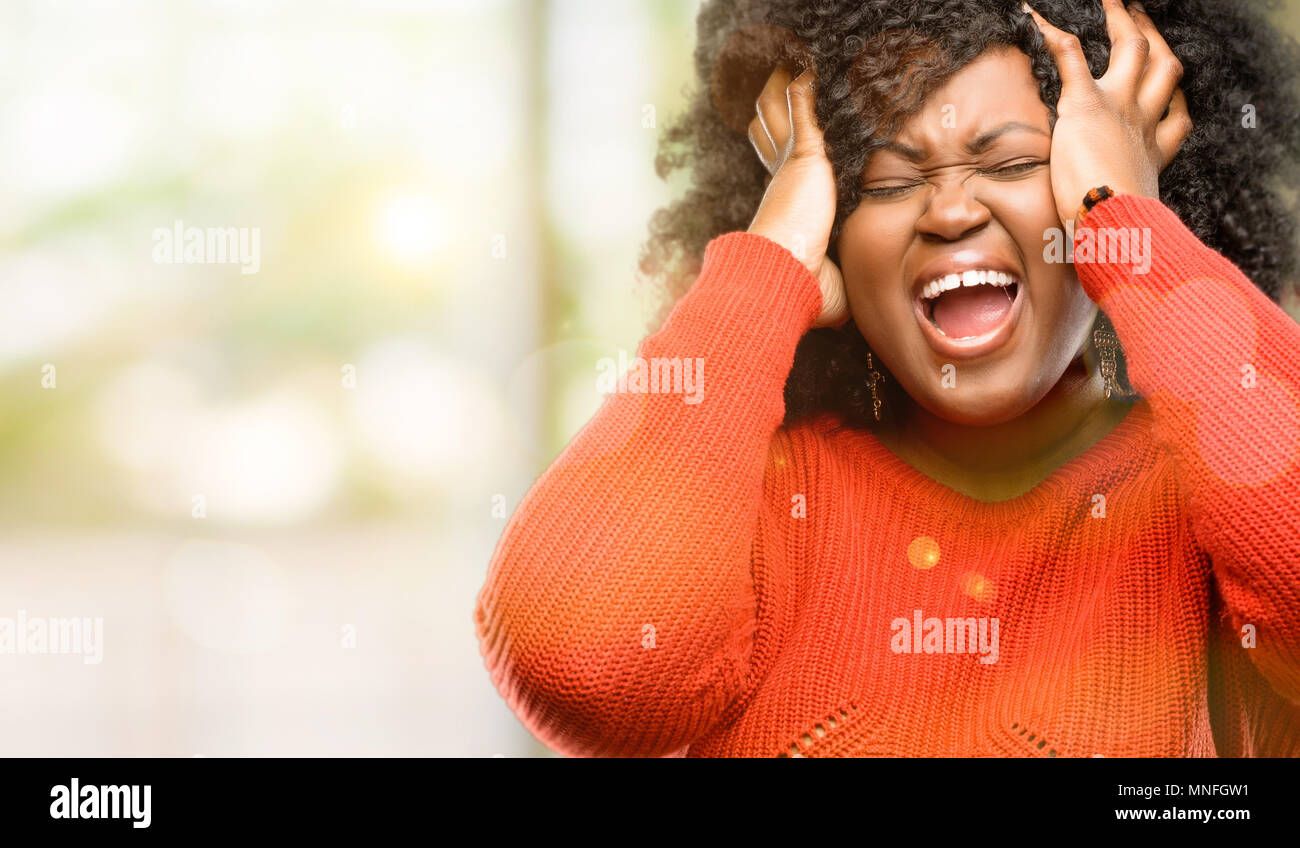 Beautiful african woman stressful keeping hands on head, terrified in ...