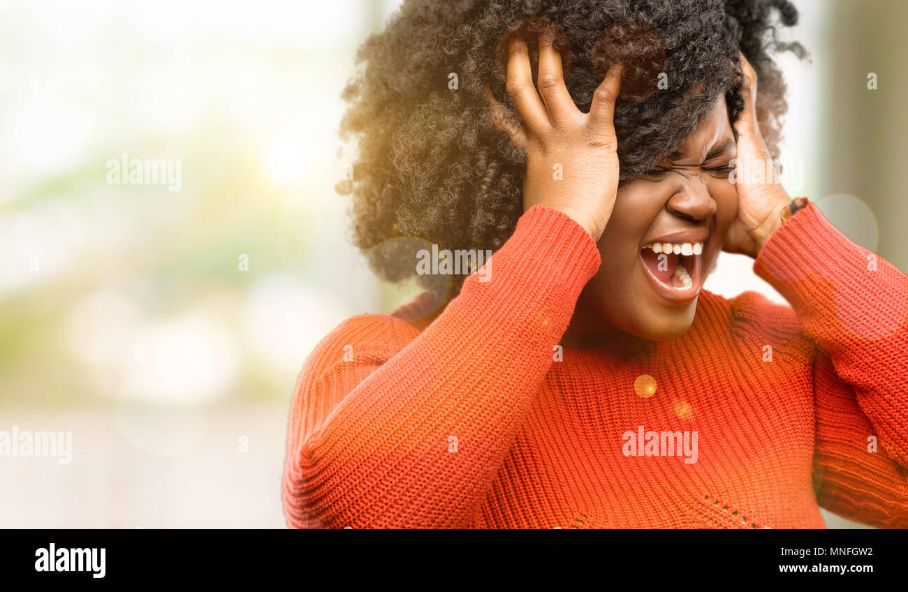 Beautiful african woman stressful keeping hands on head, terrified in ...