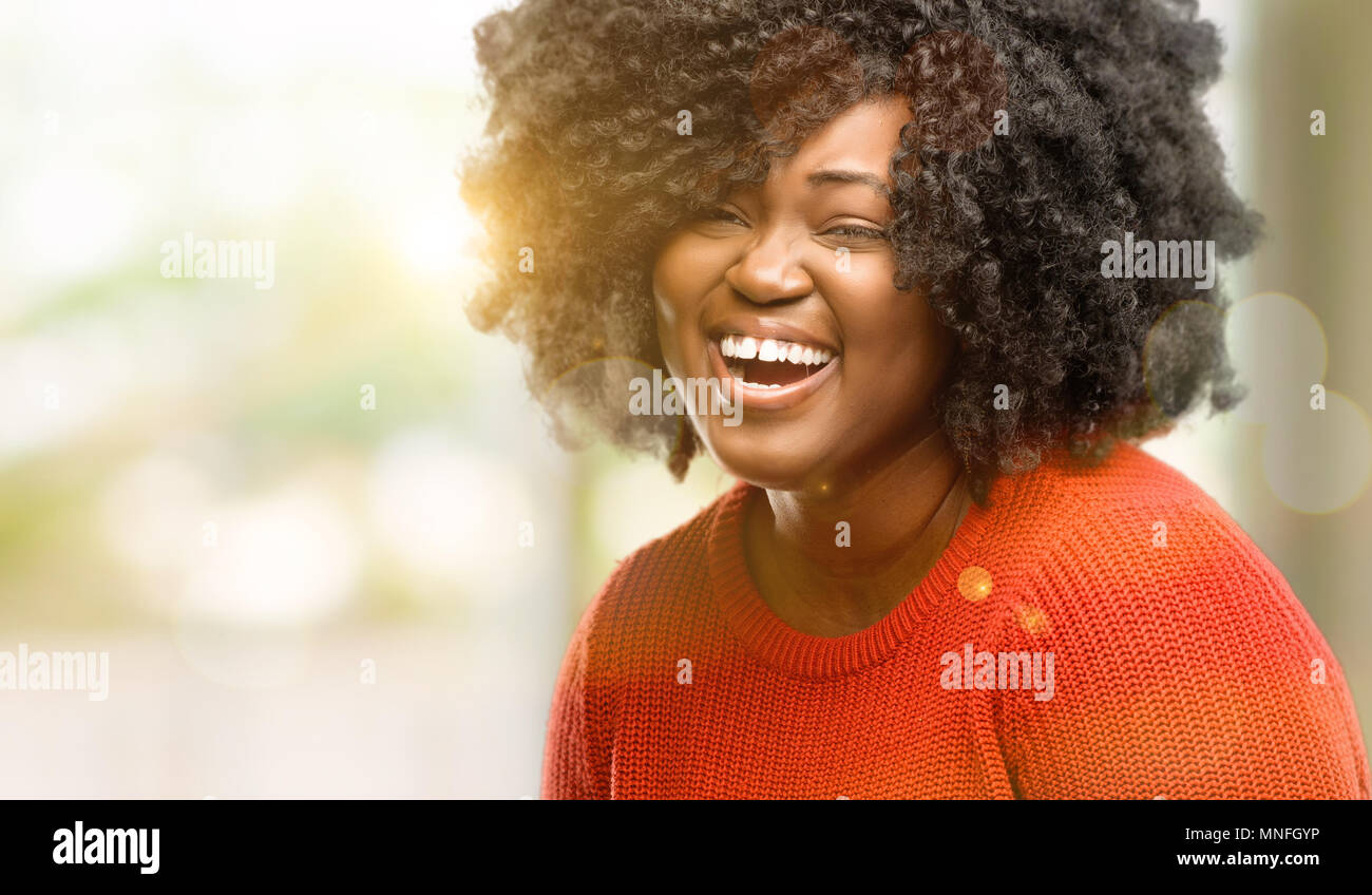 Beautiful african woman confident and happy with a big natural smile ...