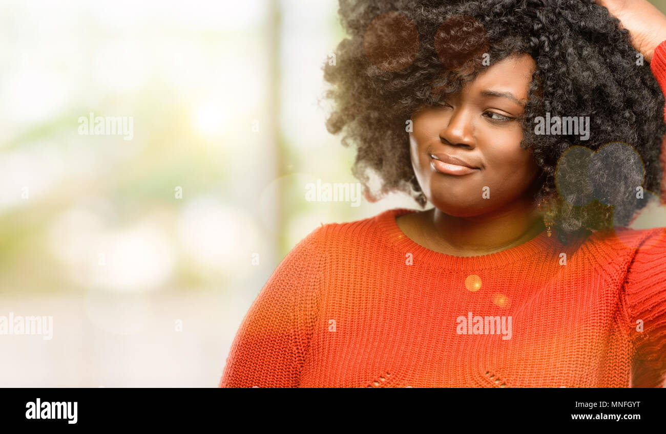 Beautiful african woman doubt expression, confuse and wonder concept ...