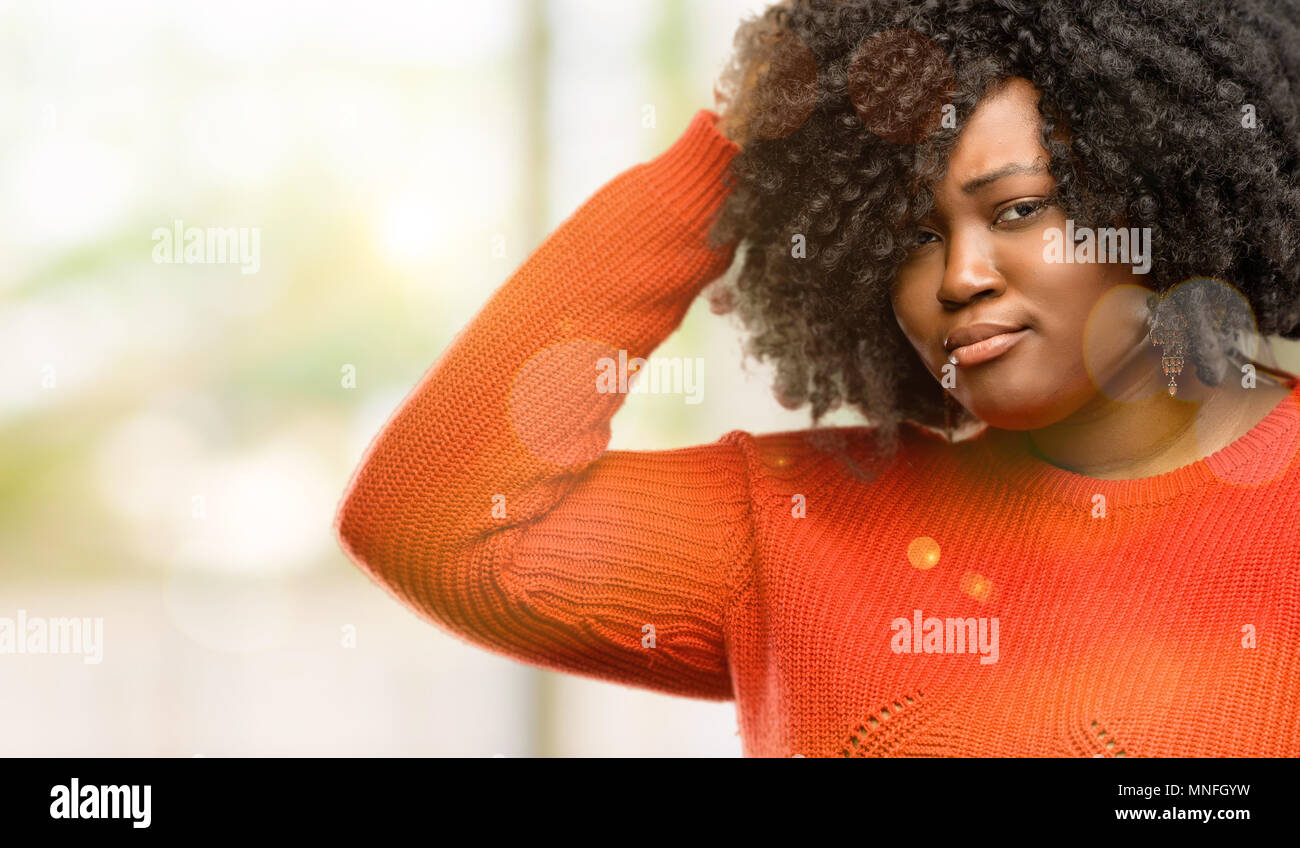 Beautiful african woman doubt expression, confuse and wonder concept ...