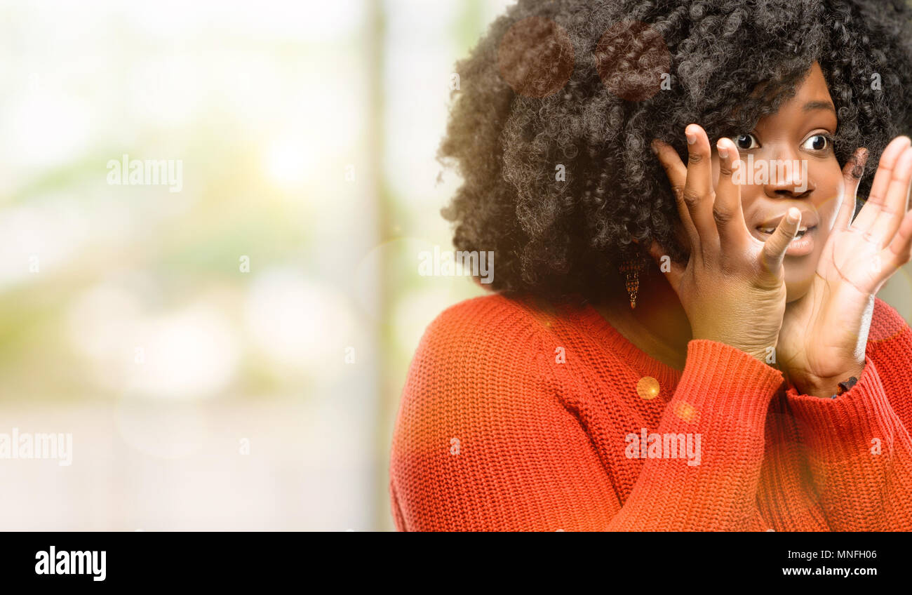 Beautiful african woman stressful keeping hands on head, terrified in ...