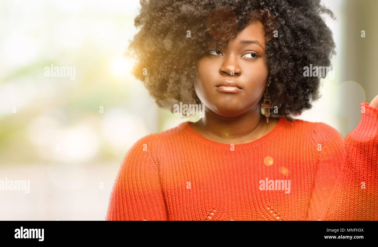 Beautiful african woman irritated and angry expressing negative emotion ...