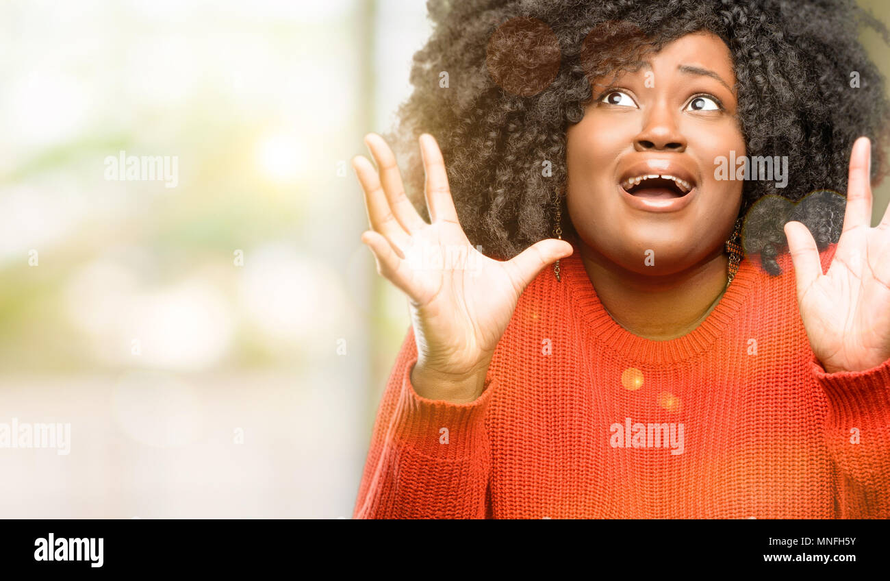 Beautiful african woman terrified and nervous expressing anxiety and ...