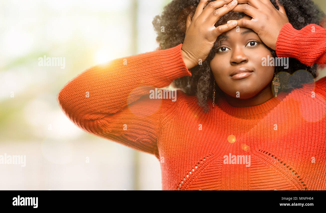 Beautiful african woman stressful keeping hands on head, terrified in ...