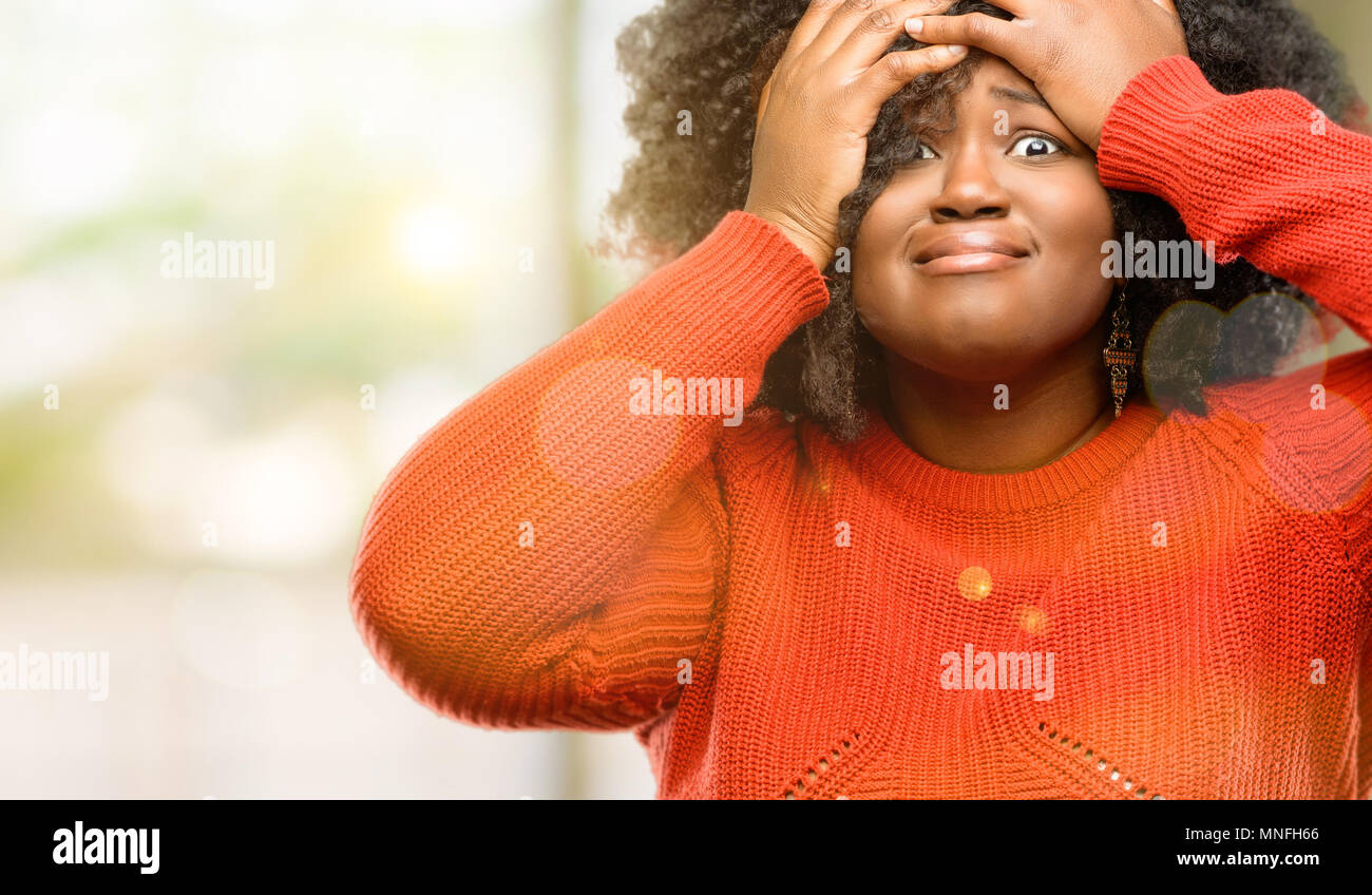 Beautiful african woman stressful keeping hands on head, terrified in ...