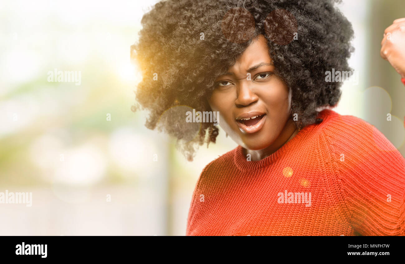 Beautiful african woman irritated and angry expressing negative emotion ...
