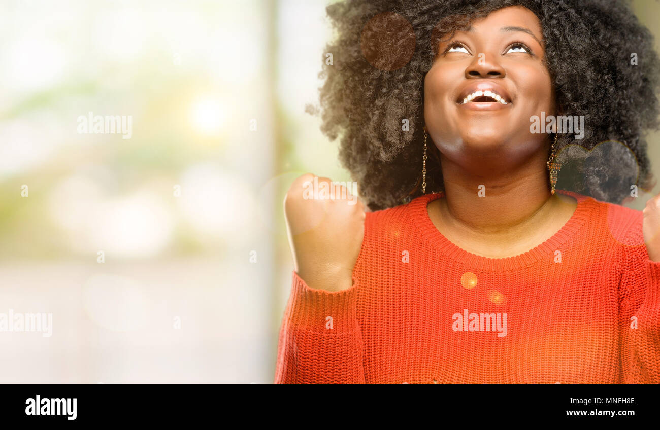 Beautiful african woman happy and excited expressing winning gesture ...