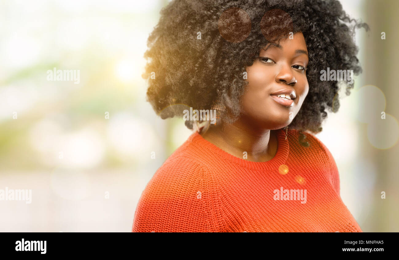 Beautiful african woman confident and happy with a big natural smile ...