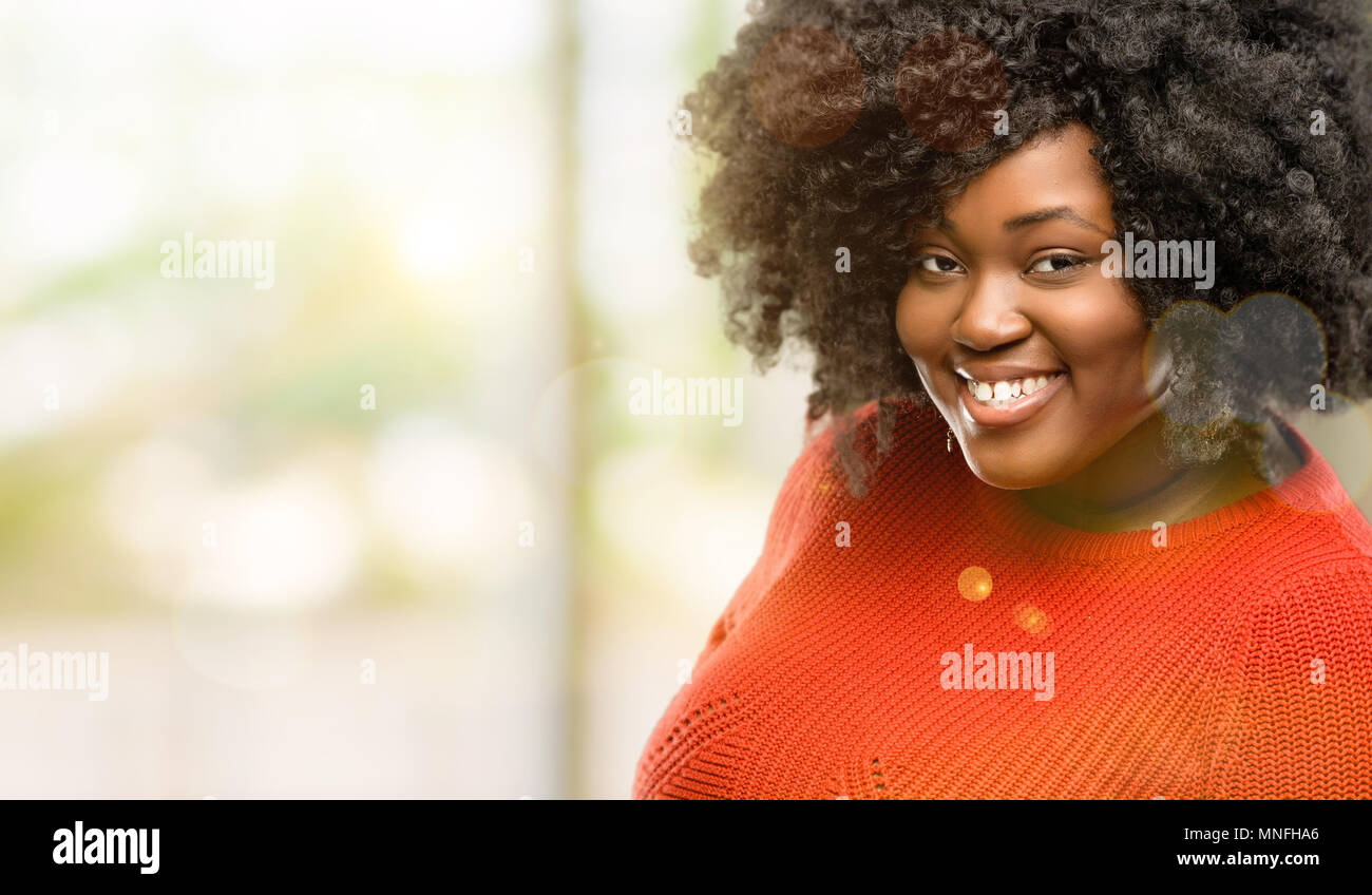 Beautiful african woman confident and happy with a big natural smile ...