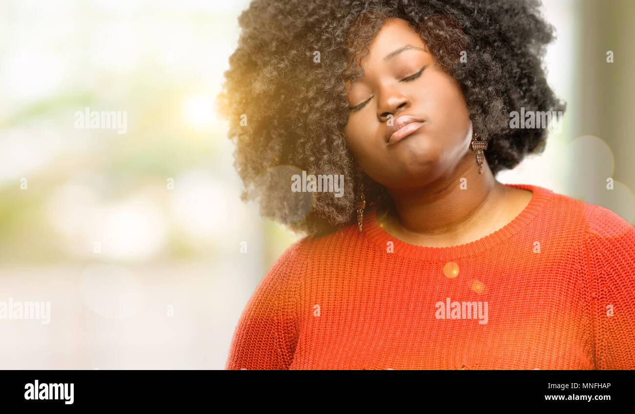 Beautiful african woman with sleepy expression, being overworked and ...