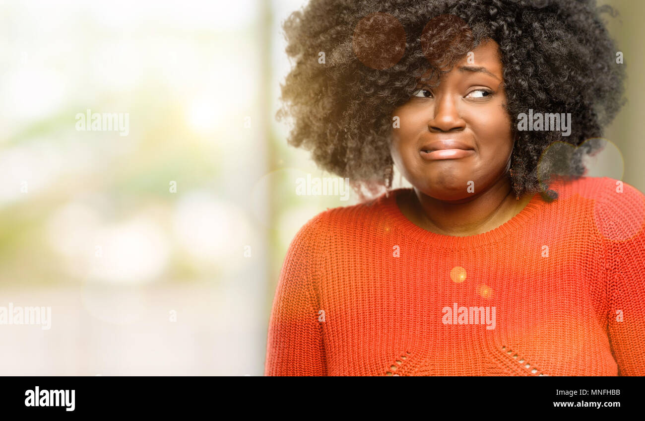 Beautiful african woman doubt expression, confuse and wonder concept ...