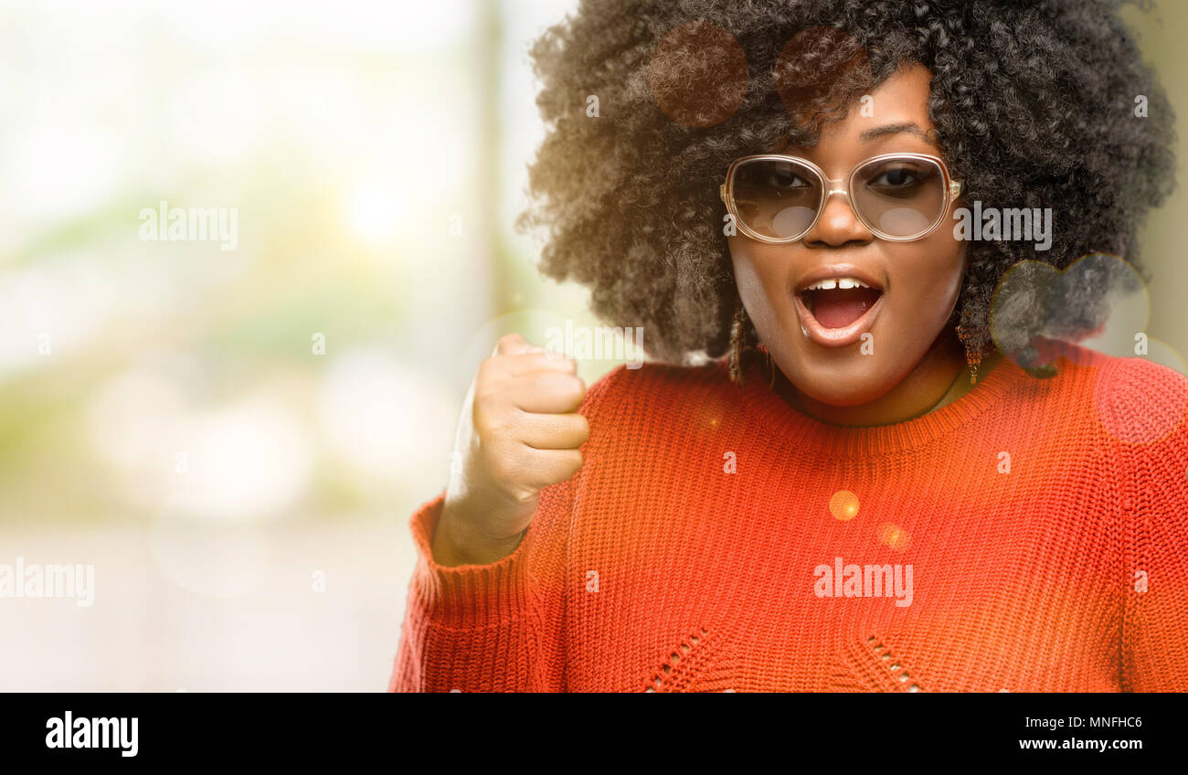 Beautiful african woman happy and excited celebrating victory ...