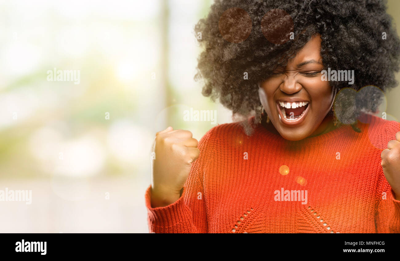 Beautiful african woman happy and excited celebrating victory ...