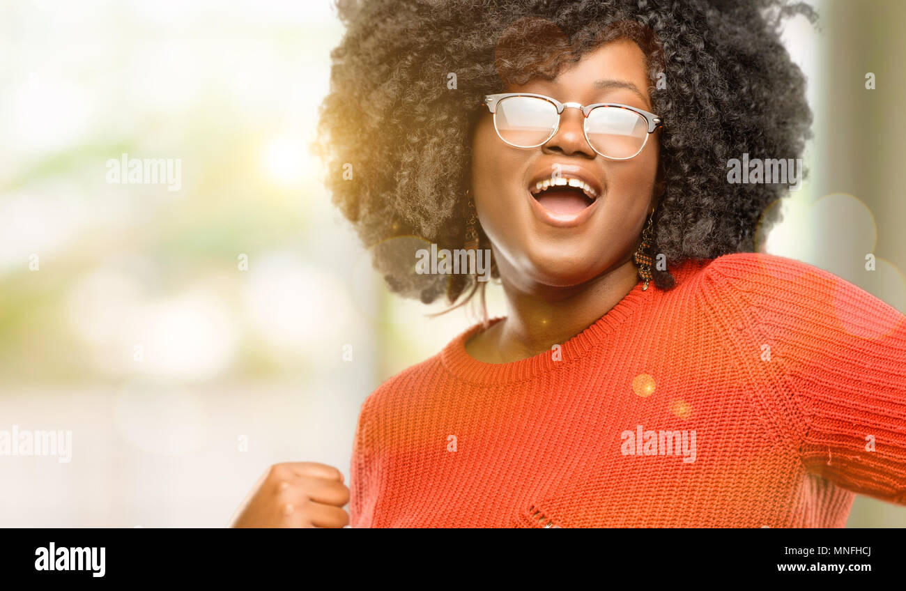 Beautiful african woman happy and excited celebrating victory ...
