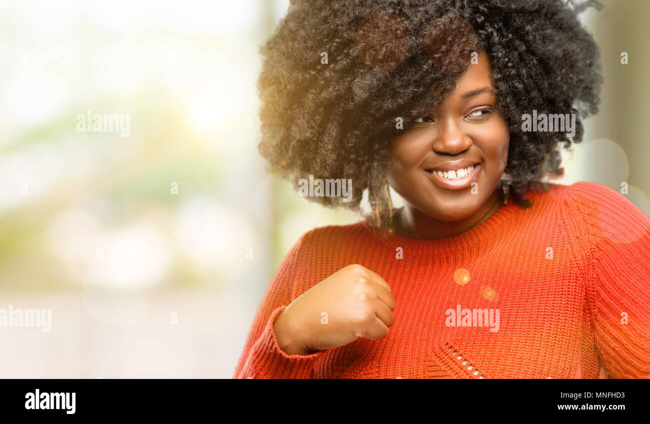Beautiful african woman happy and excited celebrating victory ...