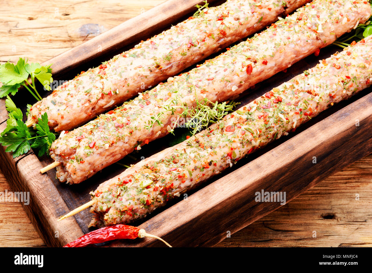 Raw turkish traditional dish meat kebab with herbs and spices.Caucasian ...