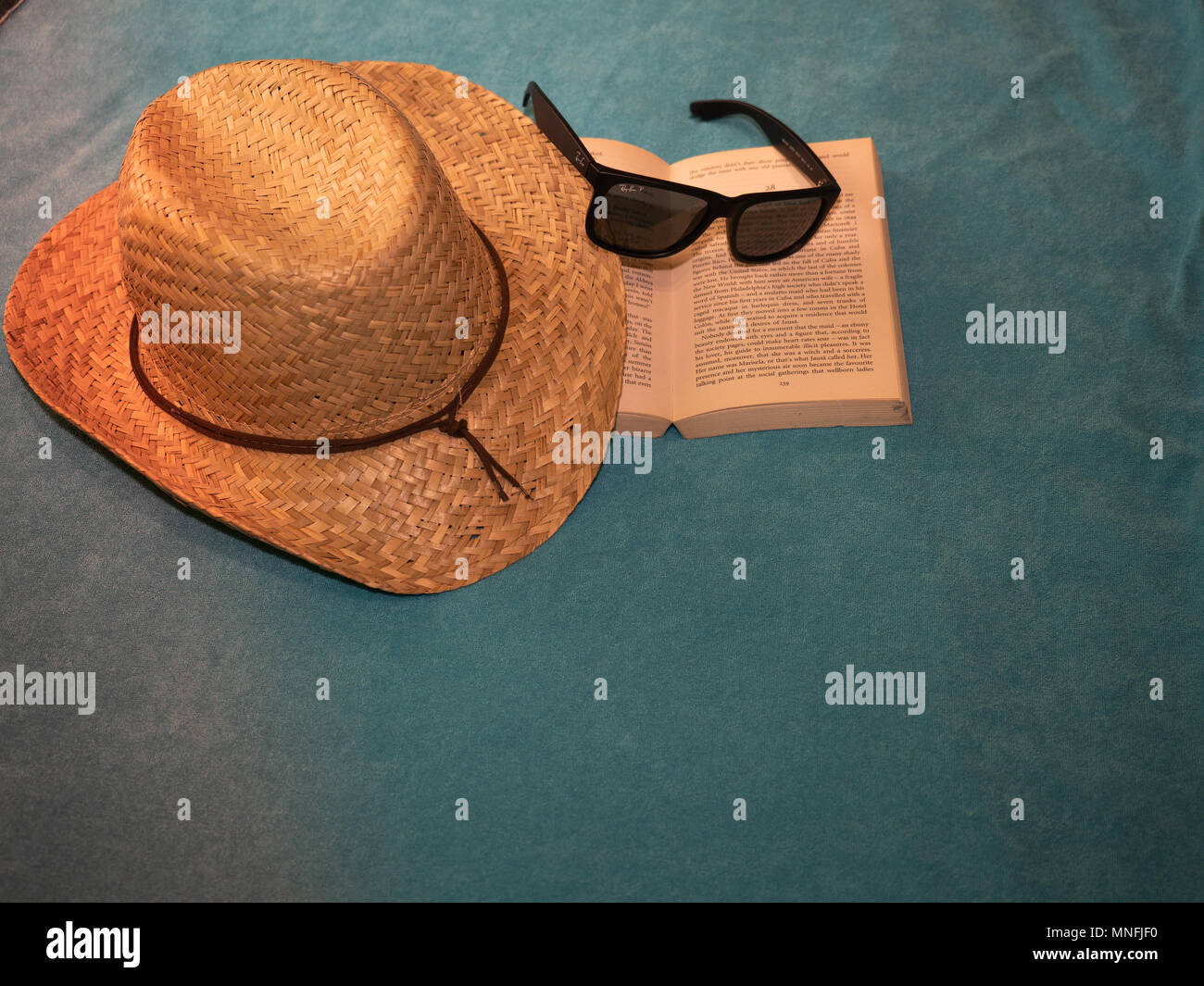 Straw hat book camera hi-res stock photography and images - Alamy