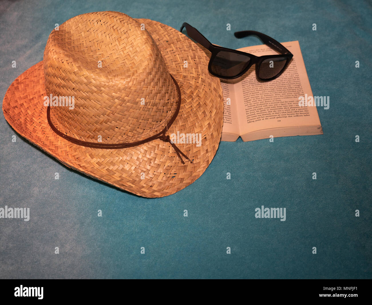 Straw hat book camera hi-res stock photography and images - Alamy