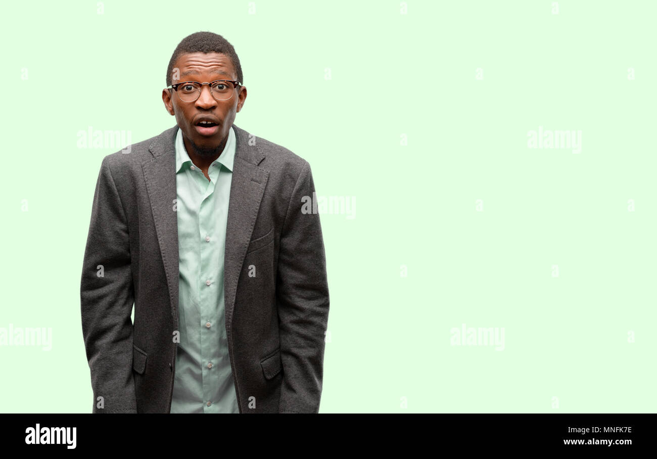 African black man wearing jacket scared in shock, expressing panic and ...