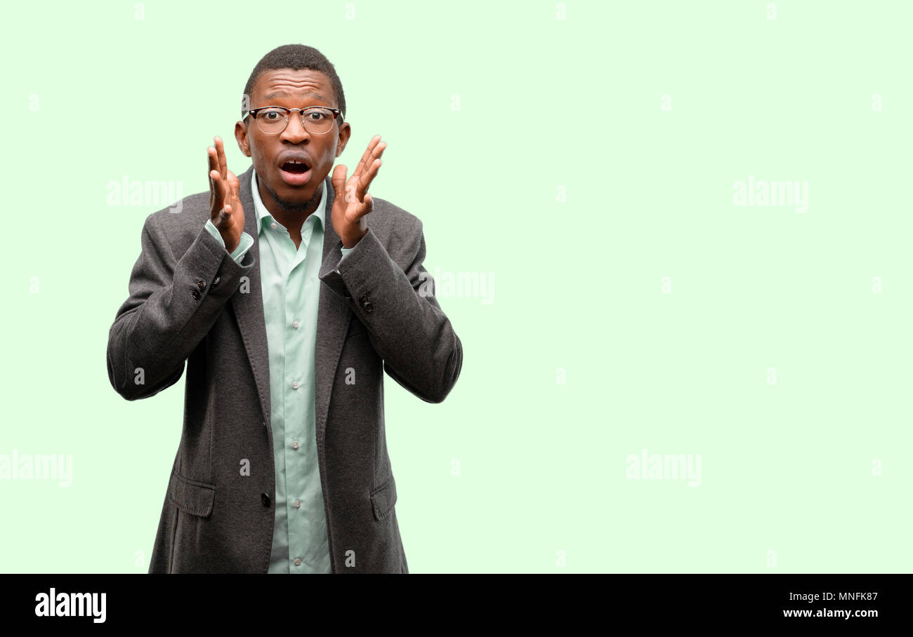 African black man wearing jacket stressful keeping hands on head ...