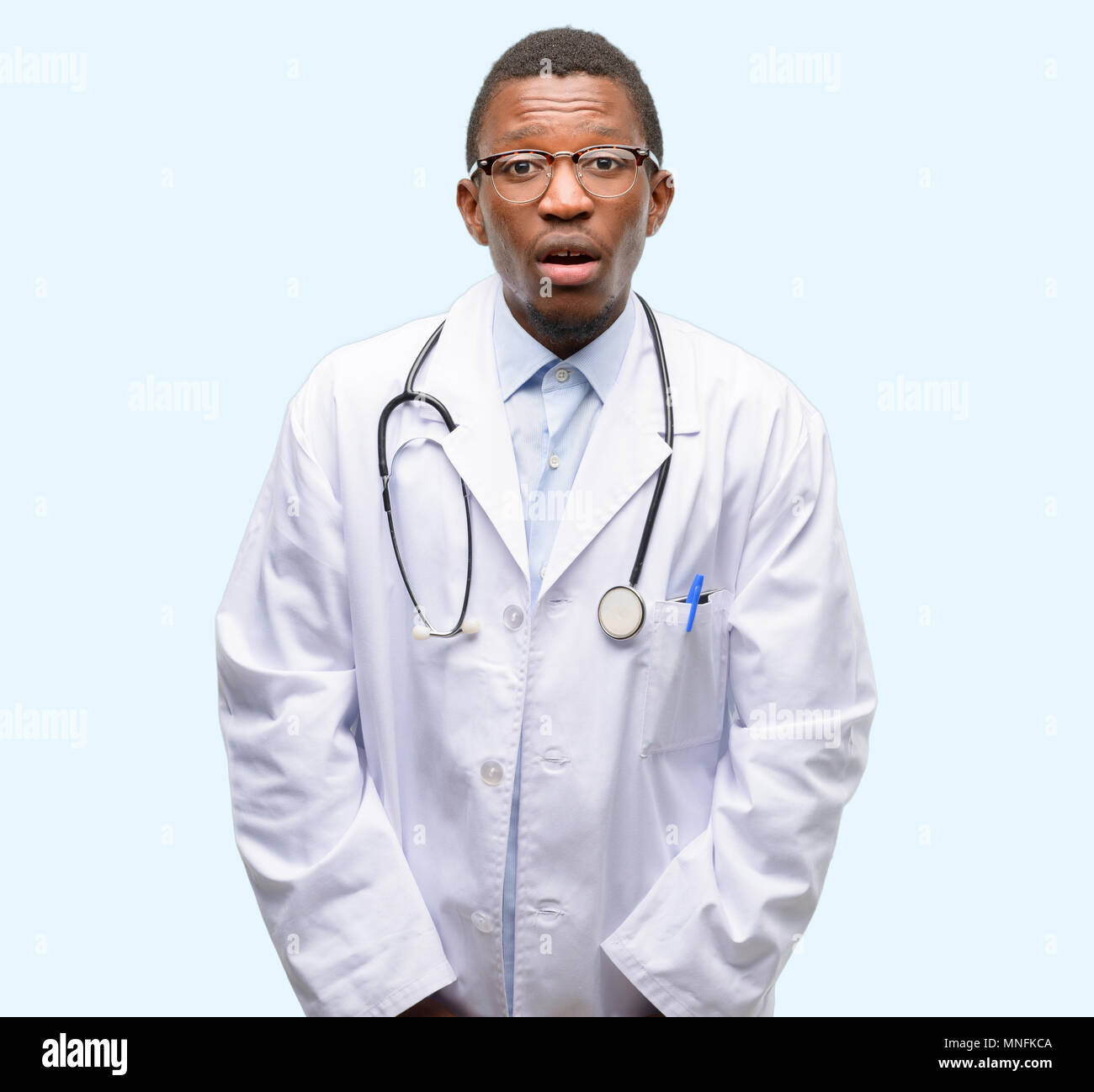 Young black doctor, medical professional scared in shock, expressing ...