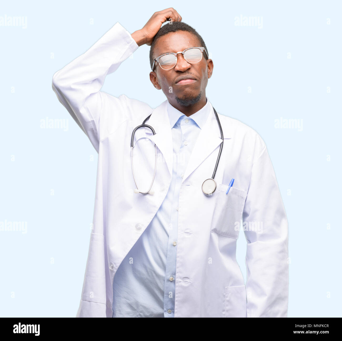 Young black doctor, medical professional doubt expression, confuse and ...