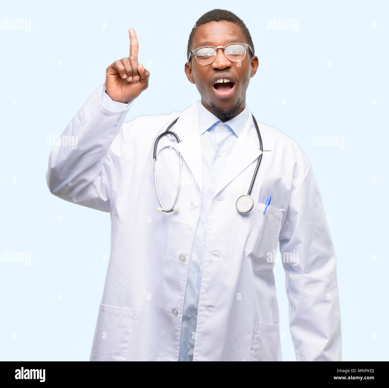Man doctor laughing pointing finger hi-res stock photography and images ...