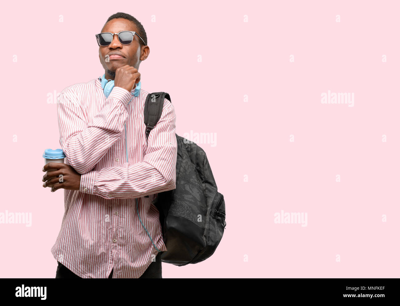 African black man student thinking and looking up expressing doubt and ...