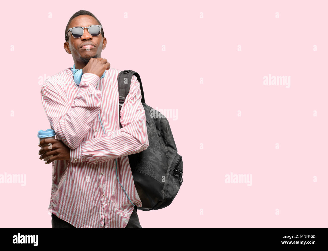 African black man student thinking and looking up expressing doubt and ...