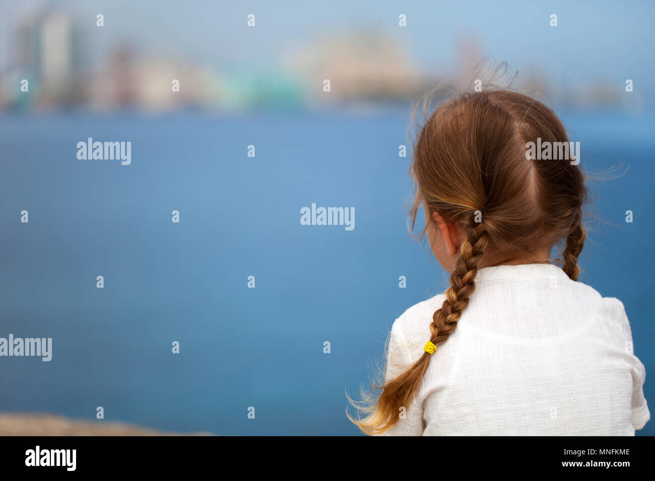 Back view of a little girl outdoors Stock Photo - Alamy