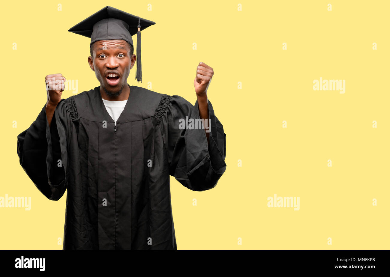 Young african graduate student black man happy and excited celebrating ...