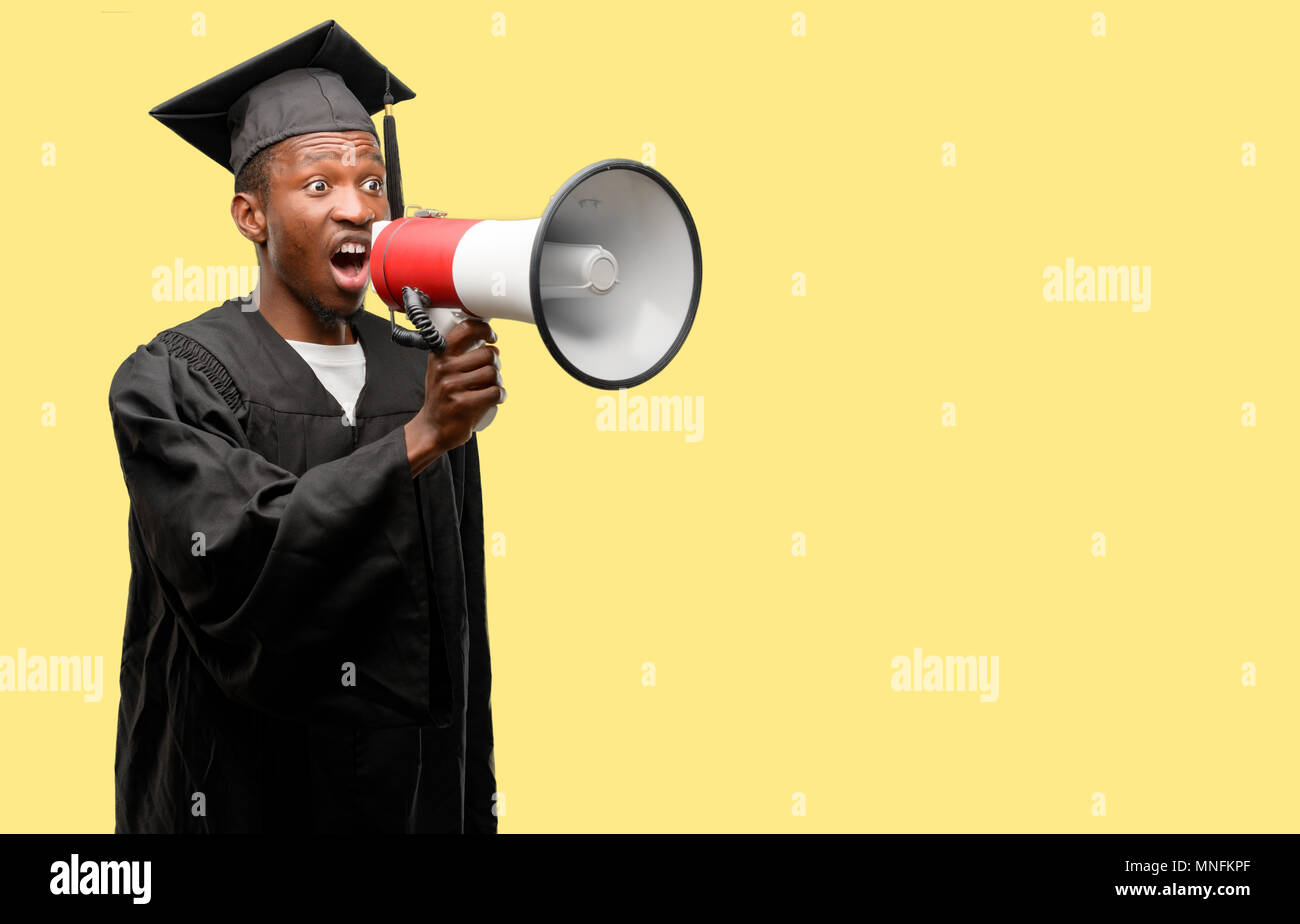 Young african graduate student black man communicates shouting loud ...