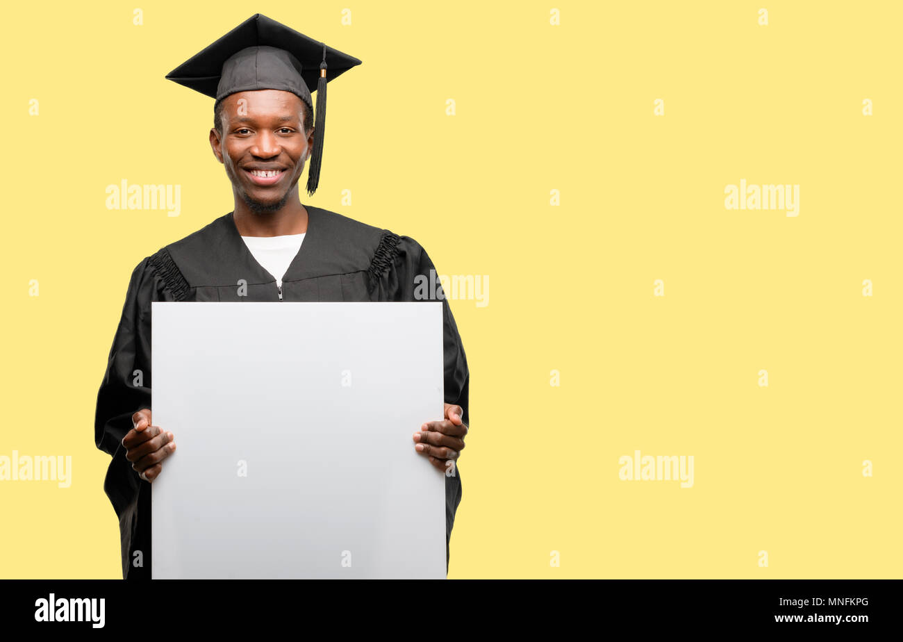 Young african graduate student black man holding blank advertising ...