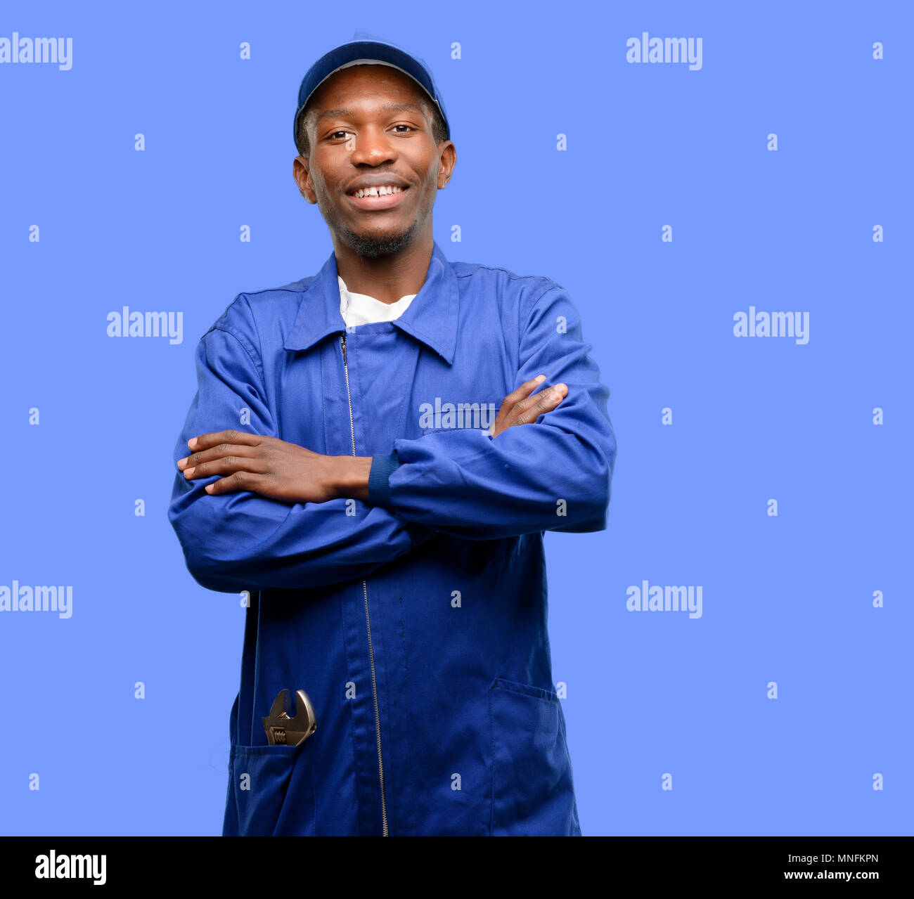 African black plumber man with crossed arms confident and happy with a ...