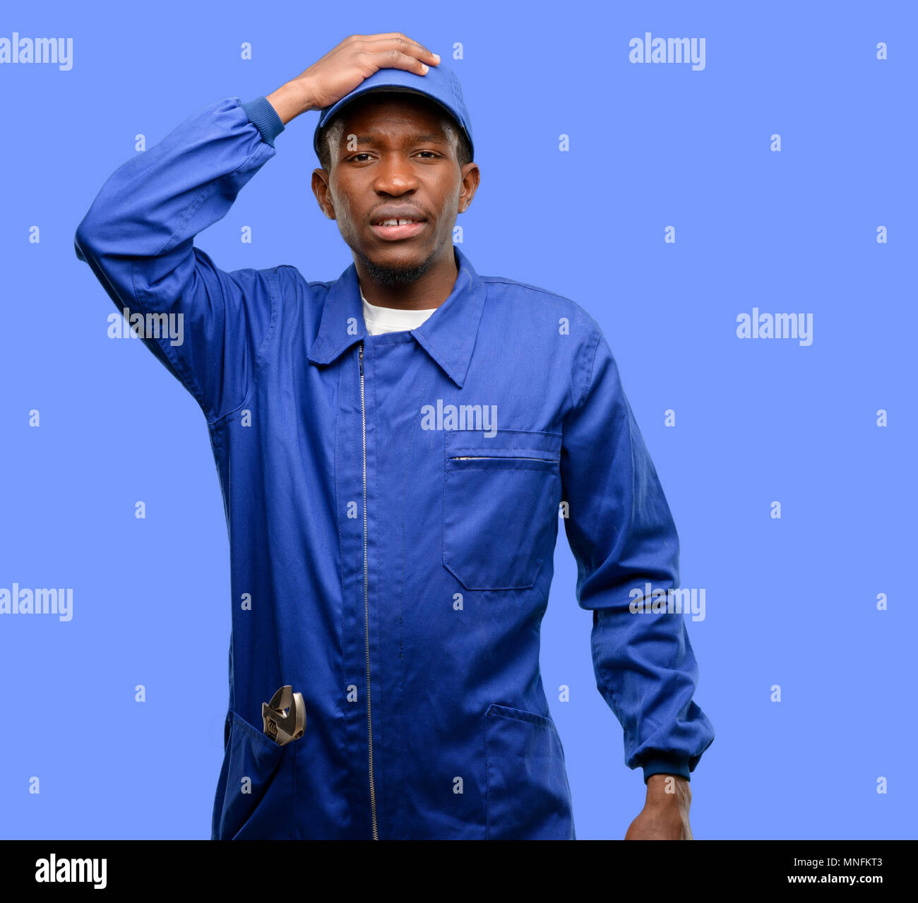 African black plumber man terrified and nervous expressing anxiety and ...