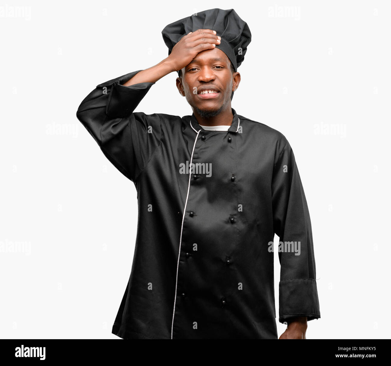 Young black cook wearing chef hat terrified and nervous expressing ...